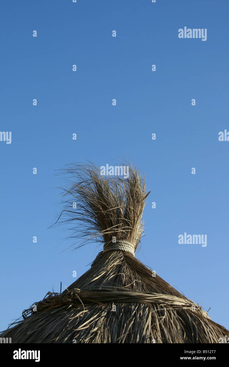 straw beach hut roof and blue sky in sun outdoors Stock Photo - Alamy