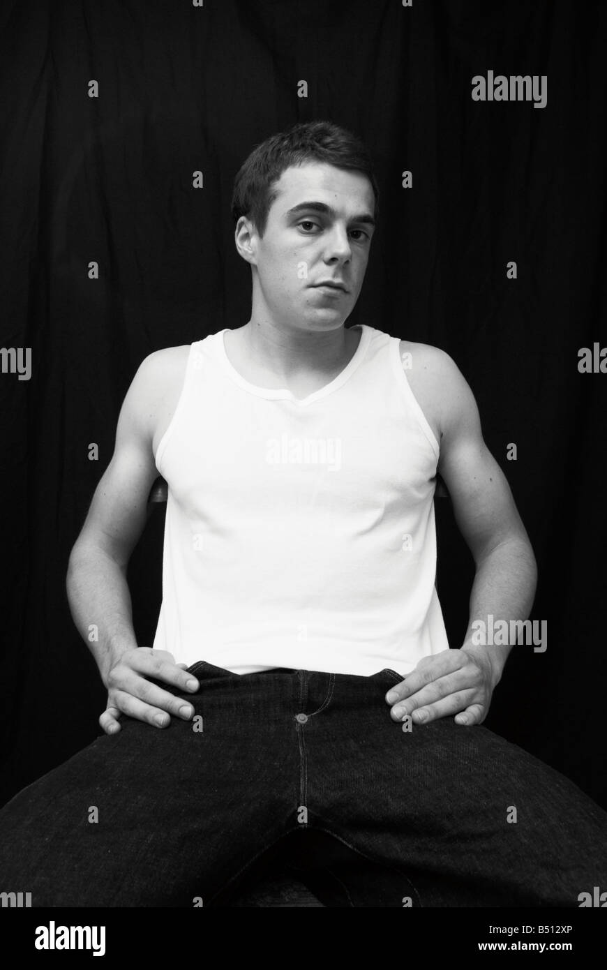 Well toned male model posing partially clothed Stock Photo - Alamy