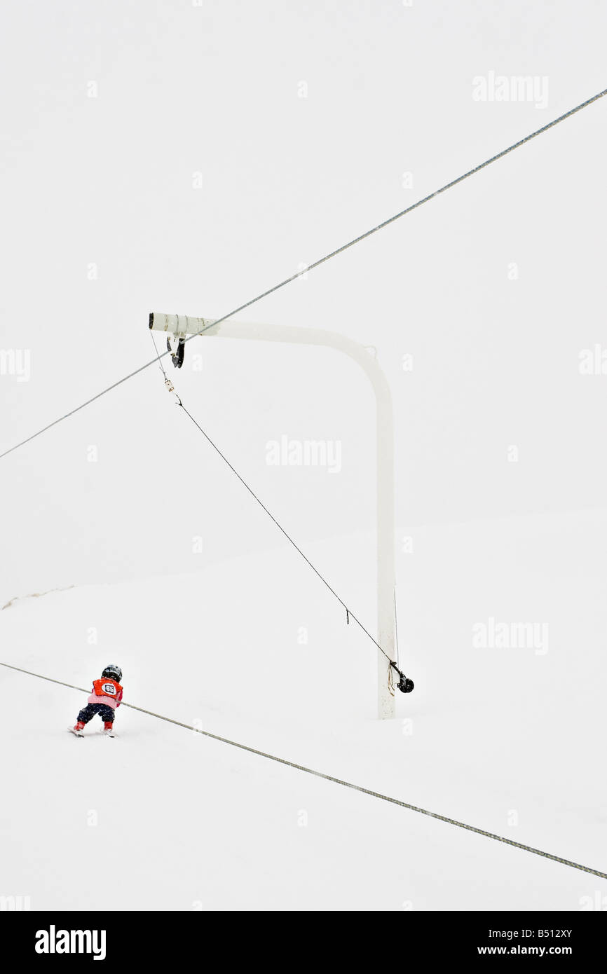 Rear view of a boy using ski lift Alps Switzerland Stock Photo - Alamy