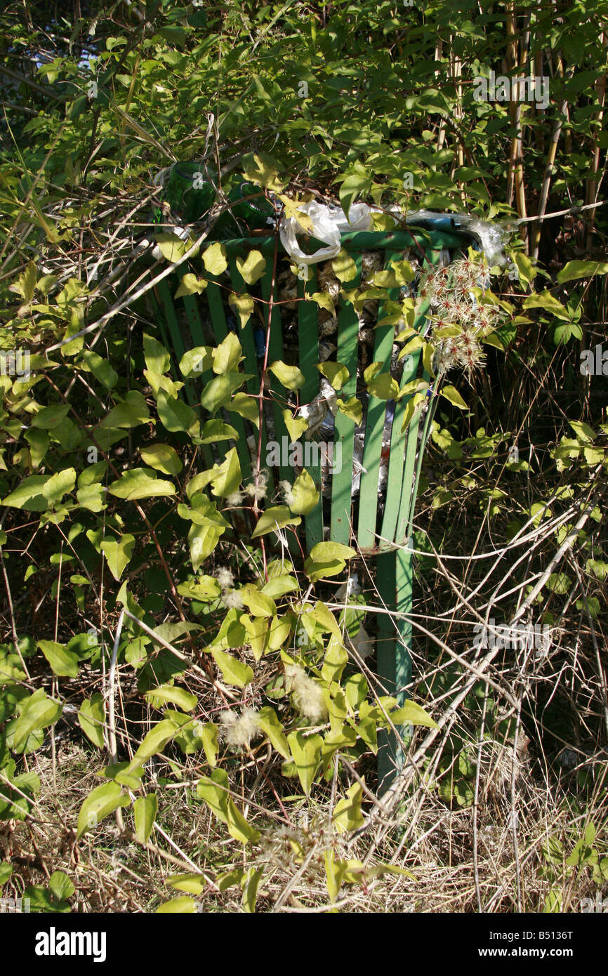 full litter rubbish bin in park in countryside Stock Photo - Alamy