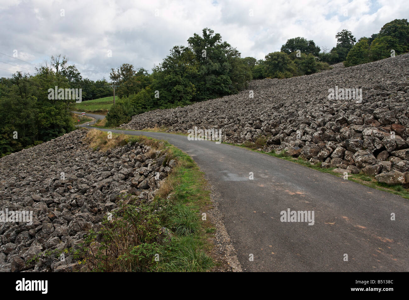 Stone boulders of a historic basalt rock flow La Coulée de Lave, St ...