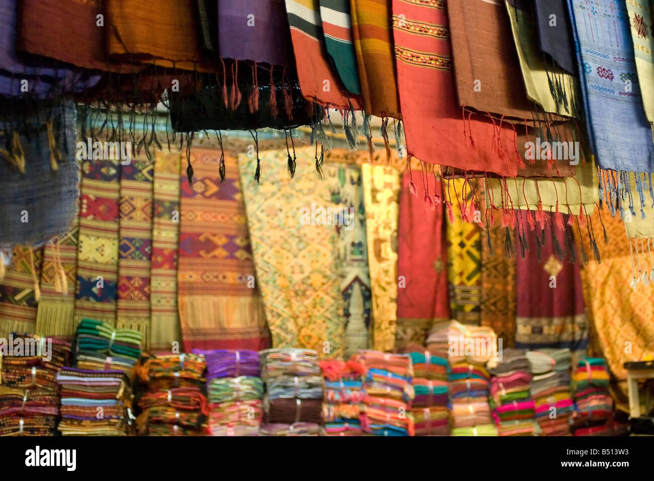 Silk scarves and table runners for sale at a market stall Stock Photo ...