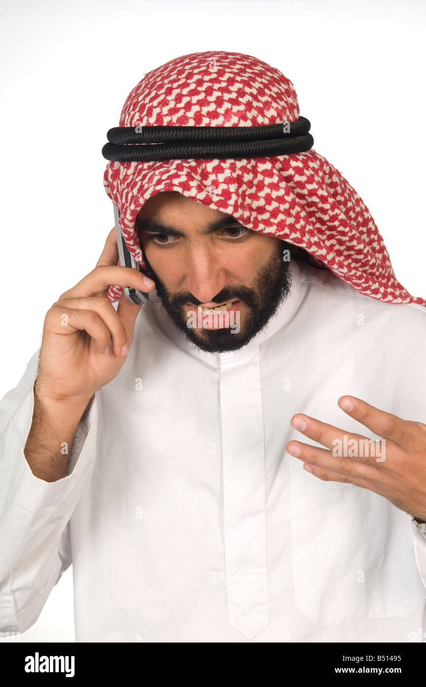 Angry Arabian man talking on mobile cellphone Stock Photo - Alamy