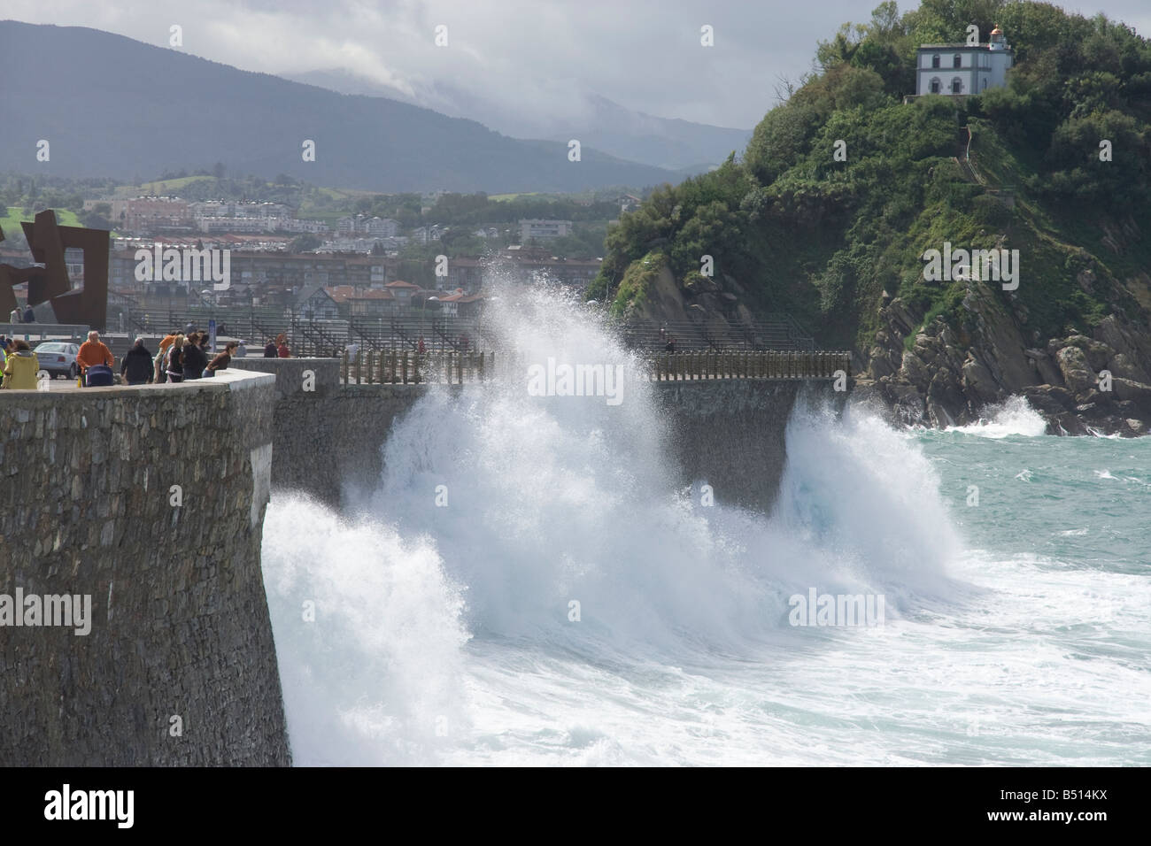 Waves crashing over the sea wall San Sebastian Stock Photo - Alamy