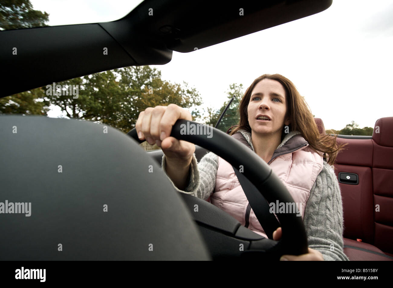 Lady driving convertible car with top down enjoying the weather Stock ...