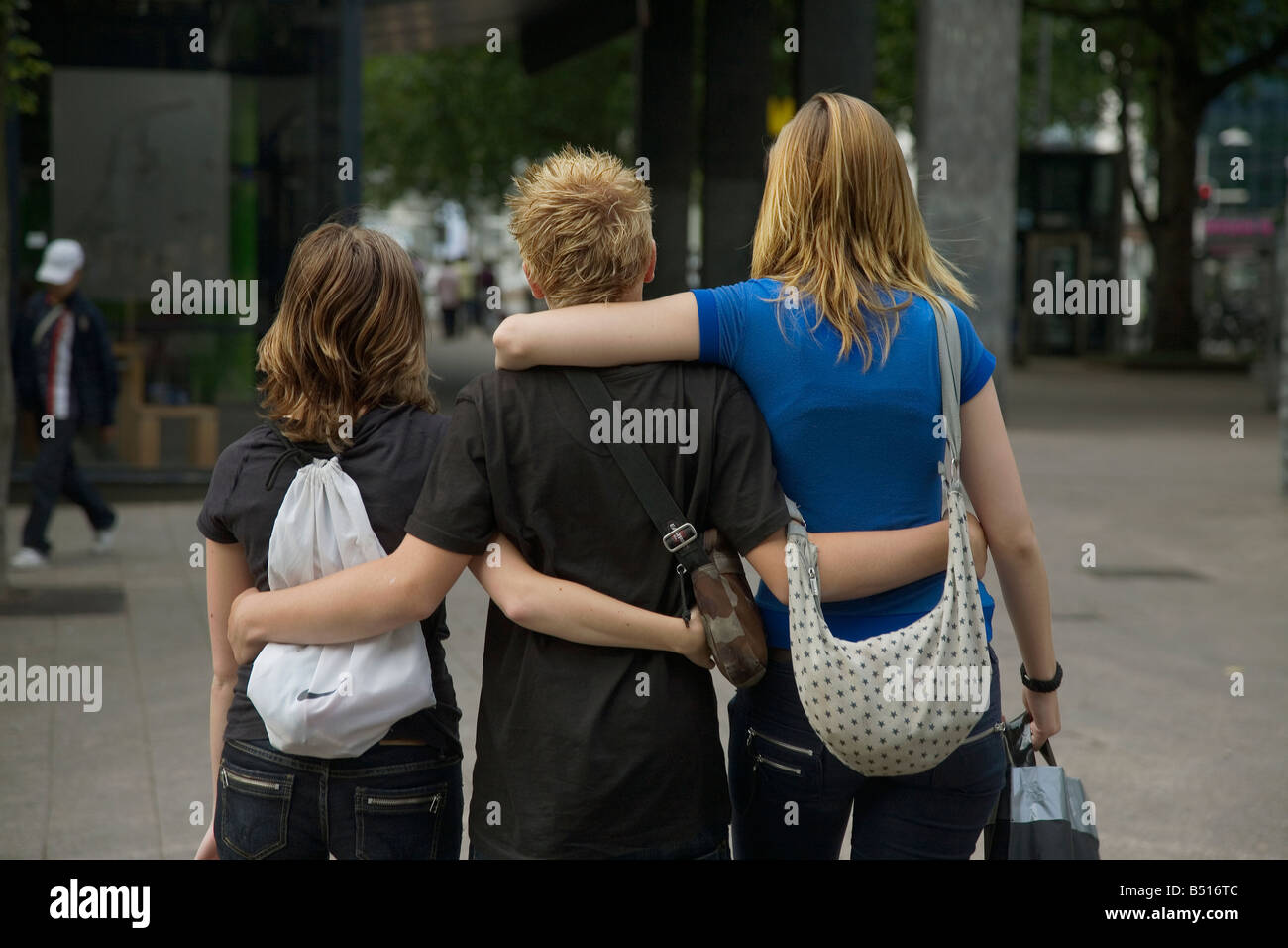 Friends embracing eachother Stock Photo - Alamy