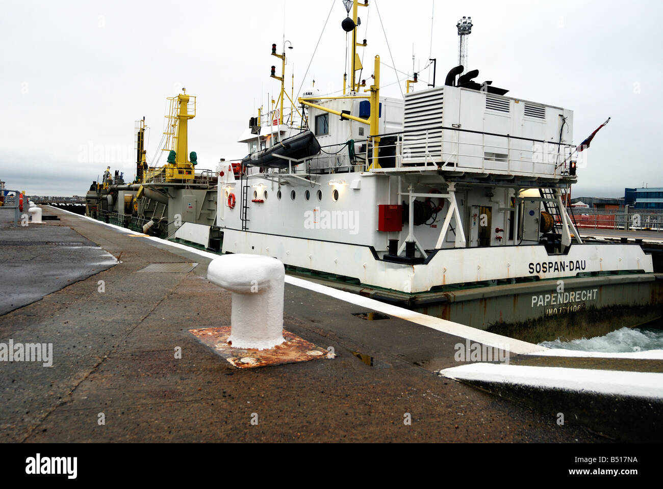 The dredger Sospan-Dau leaves Shoreham harbour through the sea lock ...