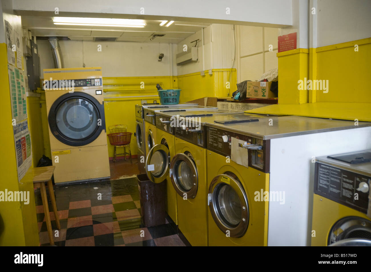 Interior of launderette with washing machines and typical decor of run ...