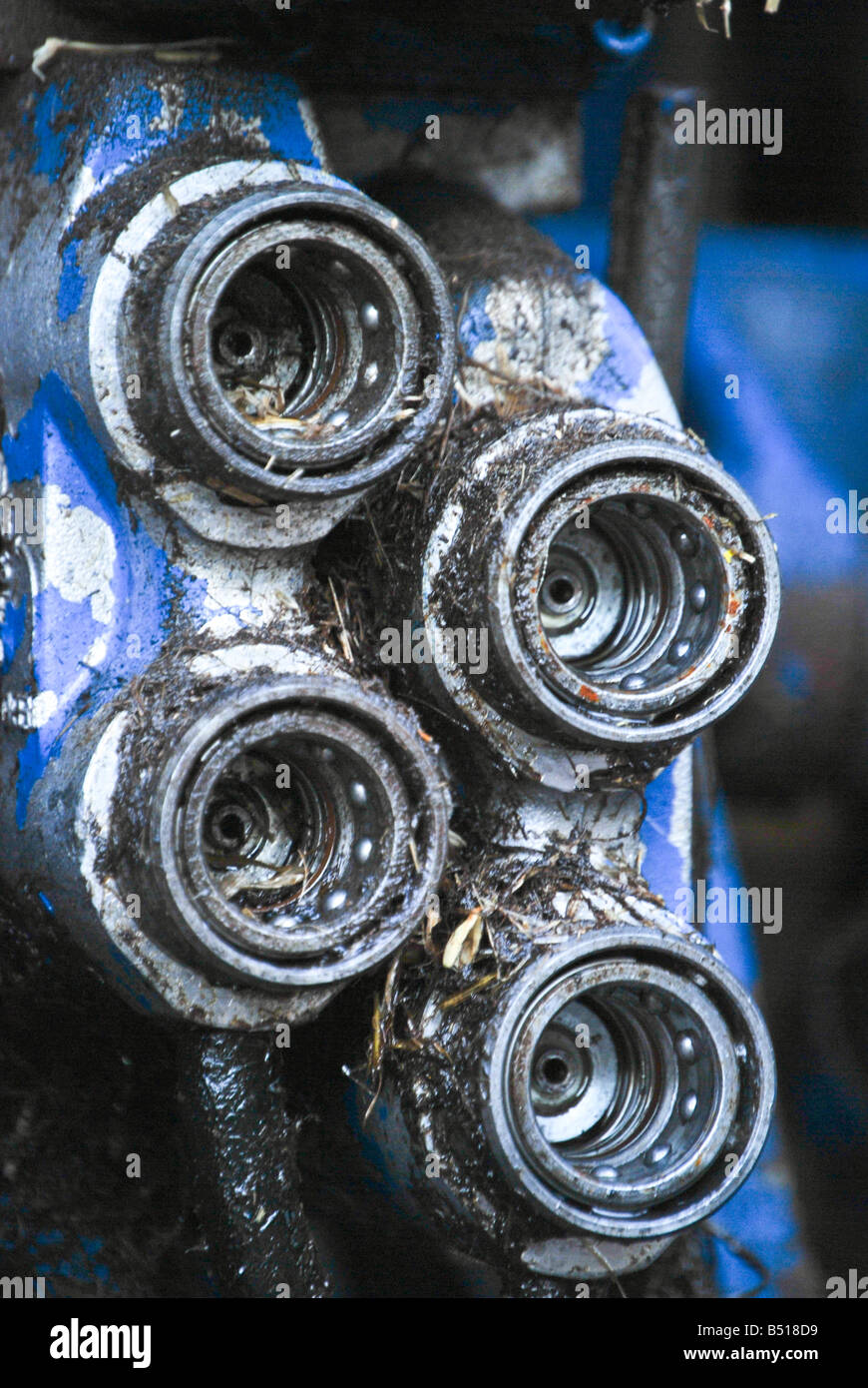 Detail image of the hydraulic couplings on the back of a farm tractor ...
