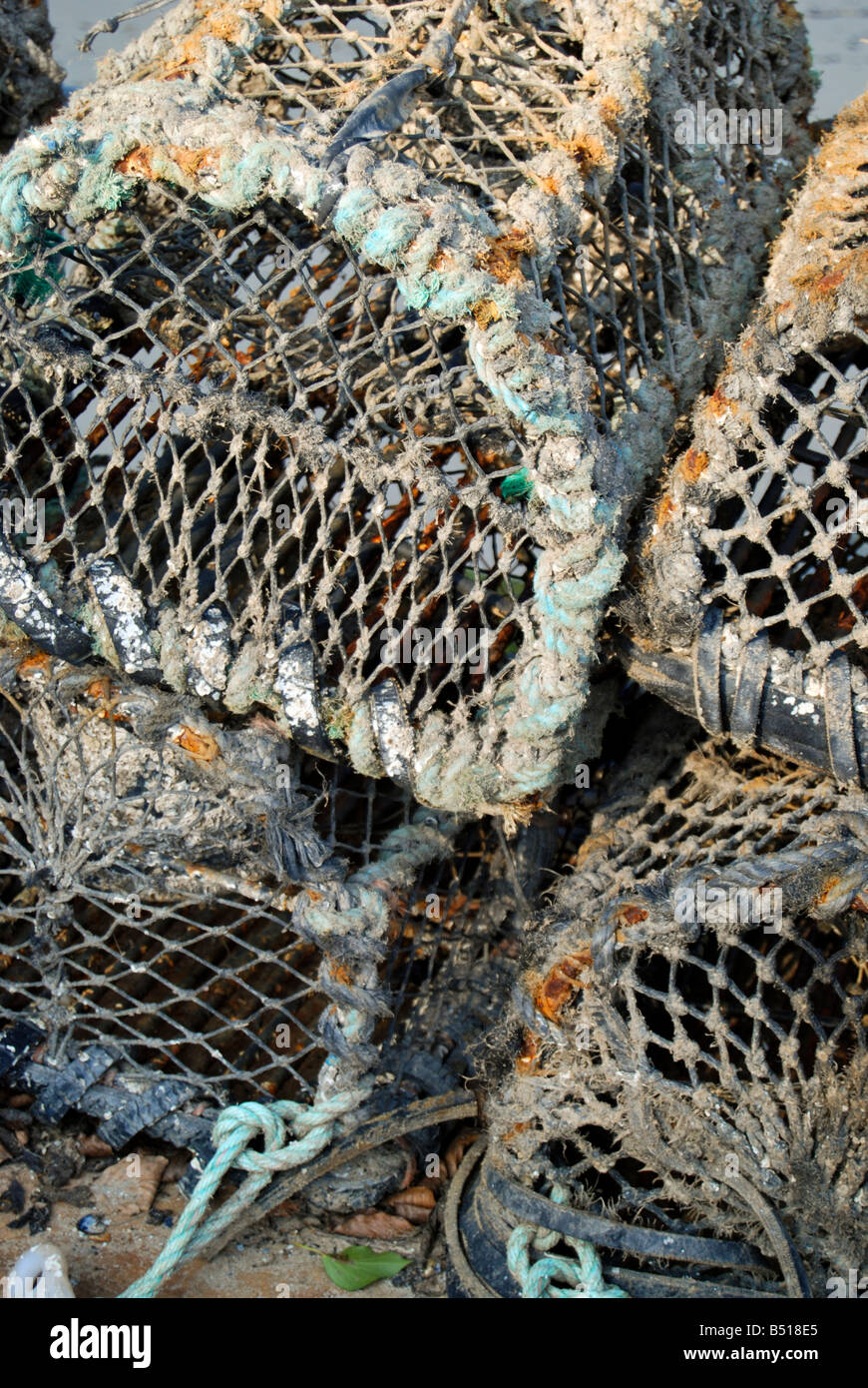 Lobster pots stacked on the quayside in Tenby Stock Photo - Alamy