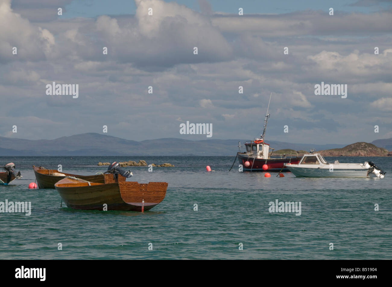 Fishing boats at anchor at the harbour in Iona, in the Inner Hebrides ...