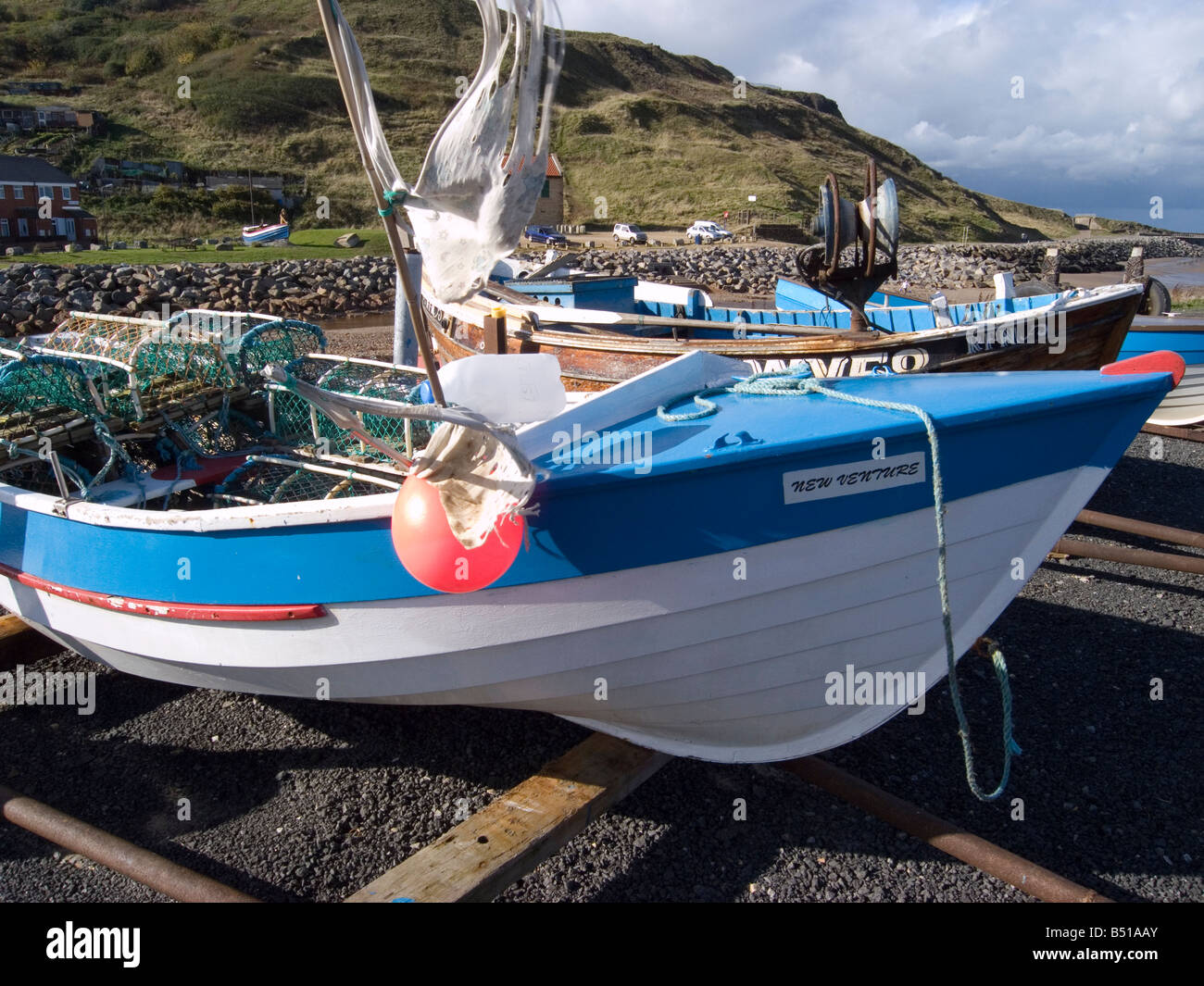Small fishing boat or coble called New Venture freshly painted and ...