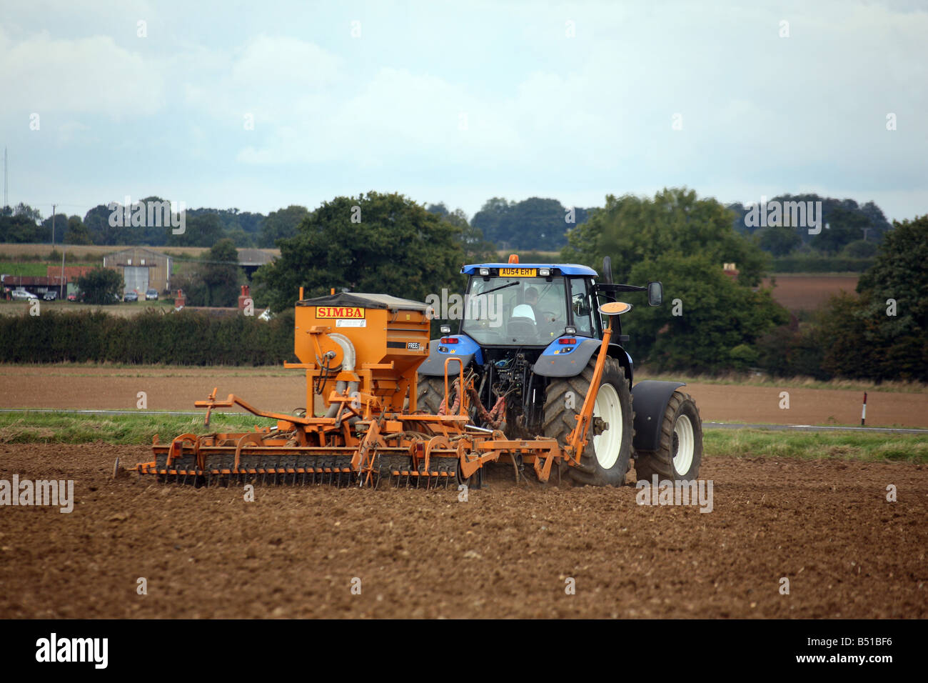 Planting winter wheat using a simba freeflow drill machine and tractor ...