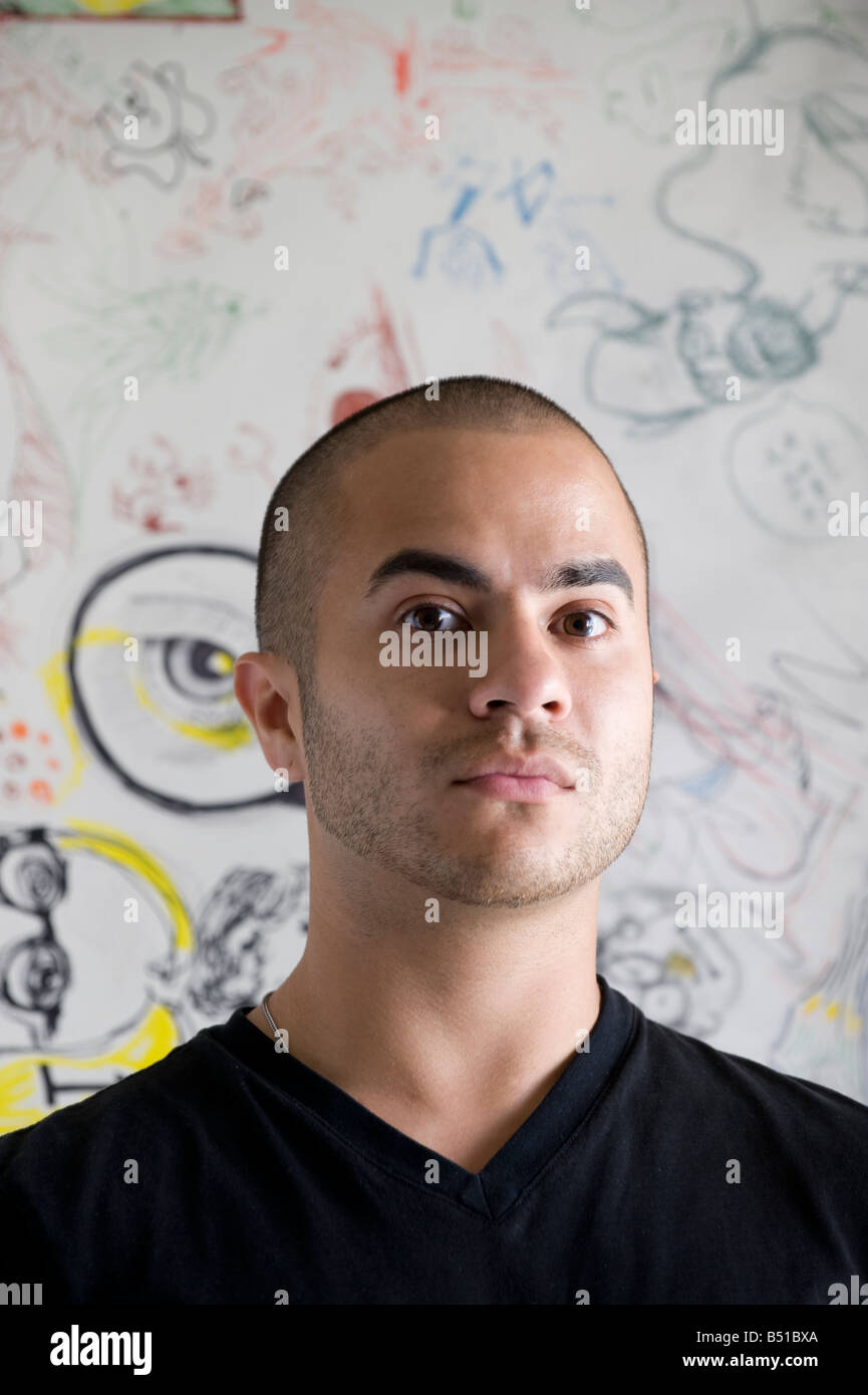 Portrait of a stoic guy with a 3rd eye drawn behind his head. Symbolic ...