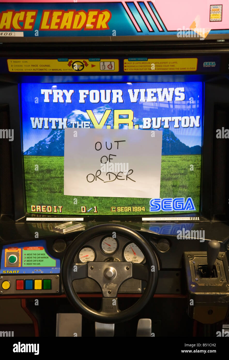 Game machine in arcade with Out of Order sign Stock Photo - Alamy