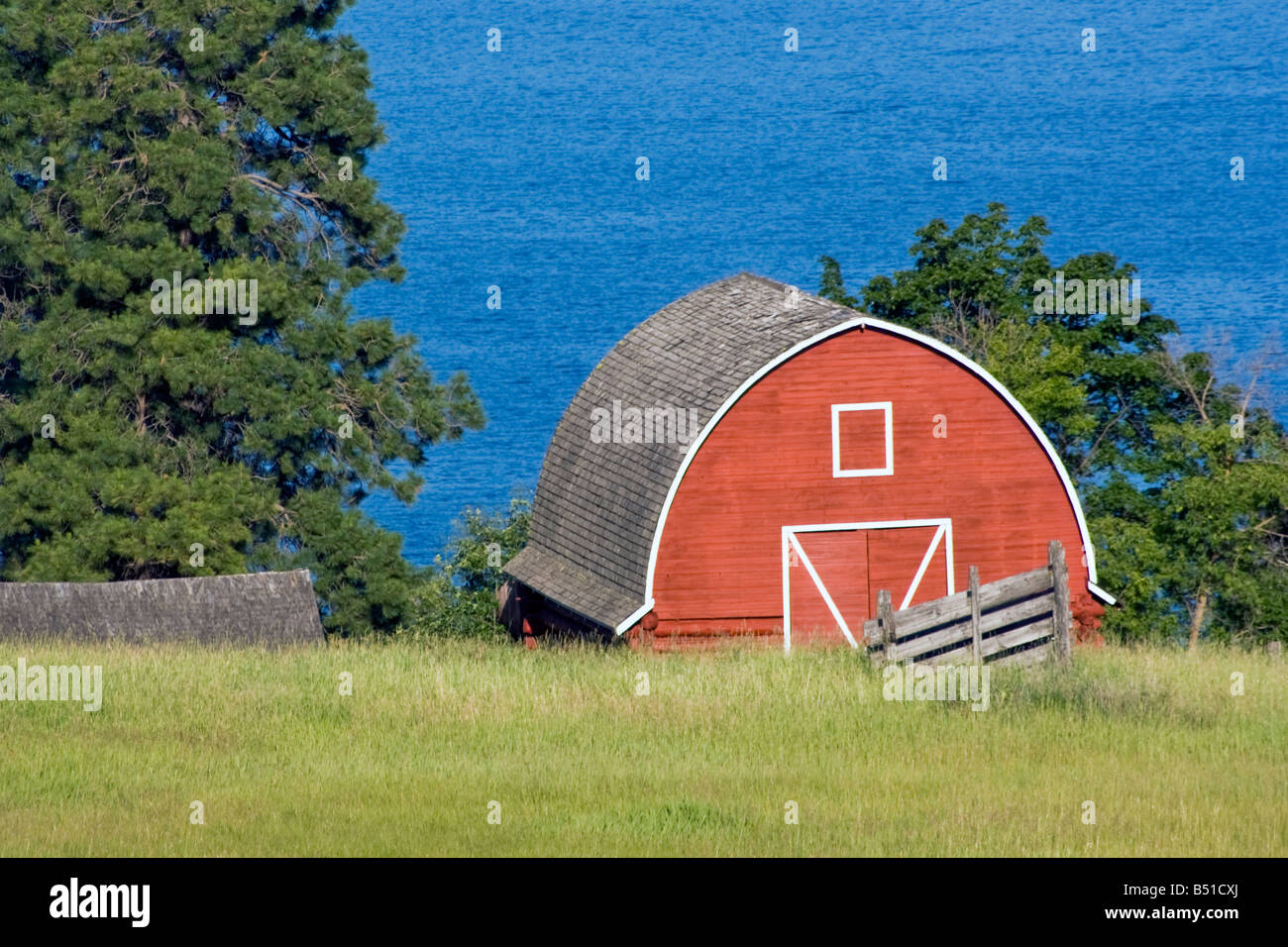 Red Barn by the Lake Stock Photo - Alamy