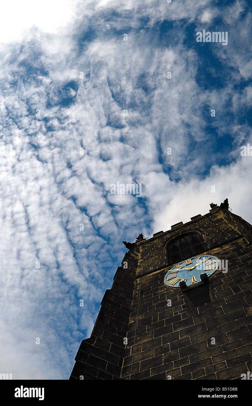 A church clock tower and overhead is a dramatic cloudy sky Stock Photo ...