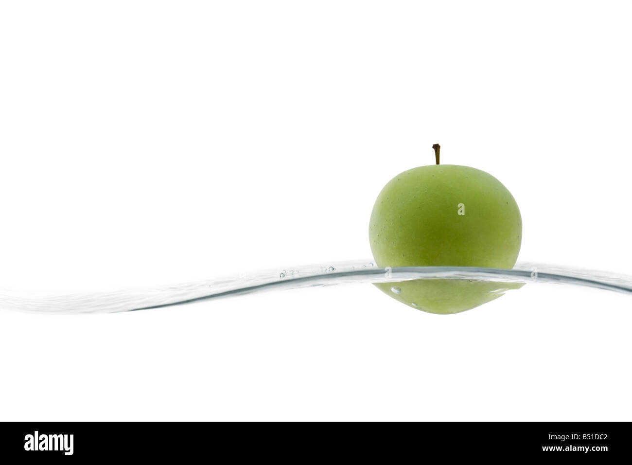 Green apple floating Stock Photo - Alamy