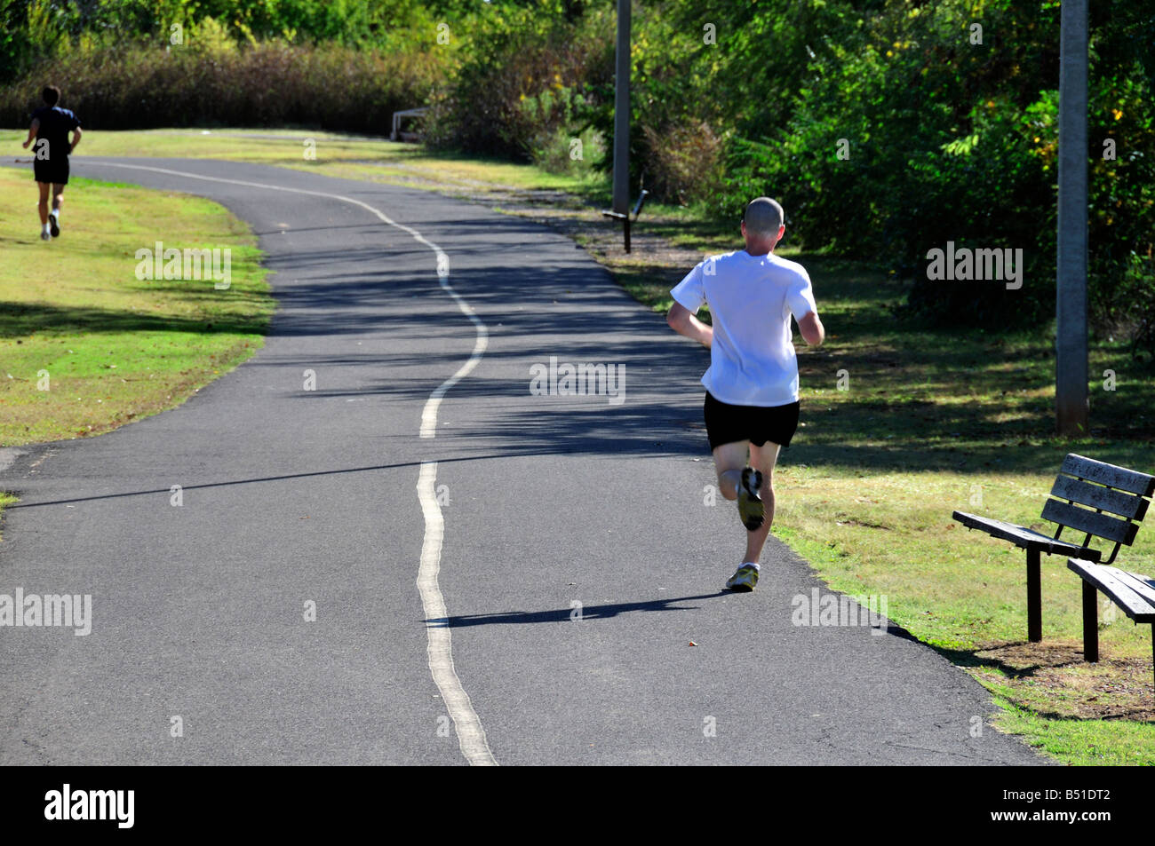 Two men run for exercise on the public trails at Lake Hefner, Oklahoma ...