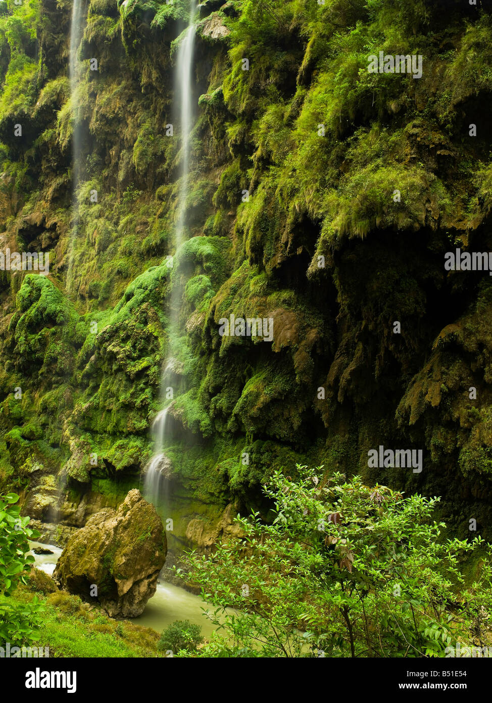 waterfall on moss covered rocks Stock Photo - Alamy
