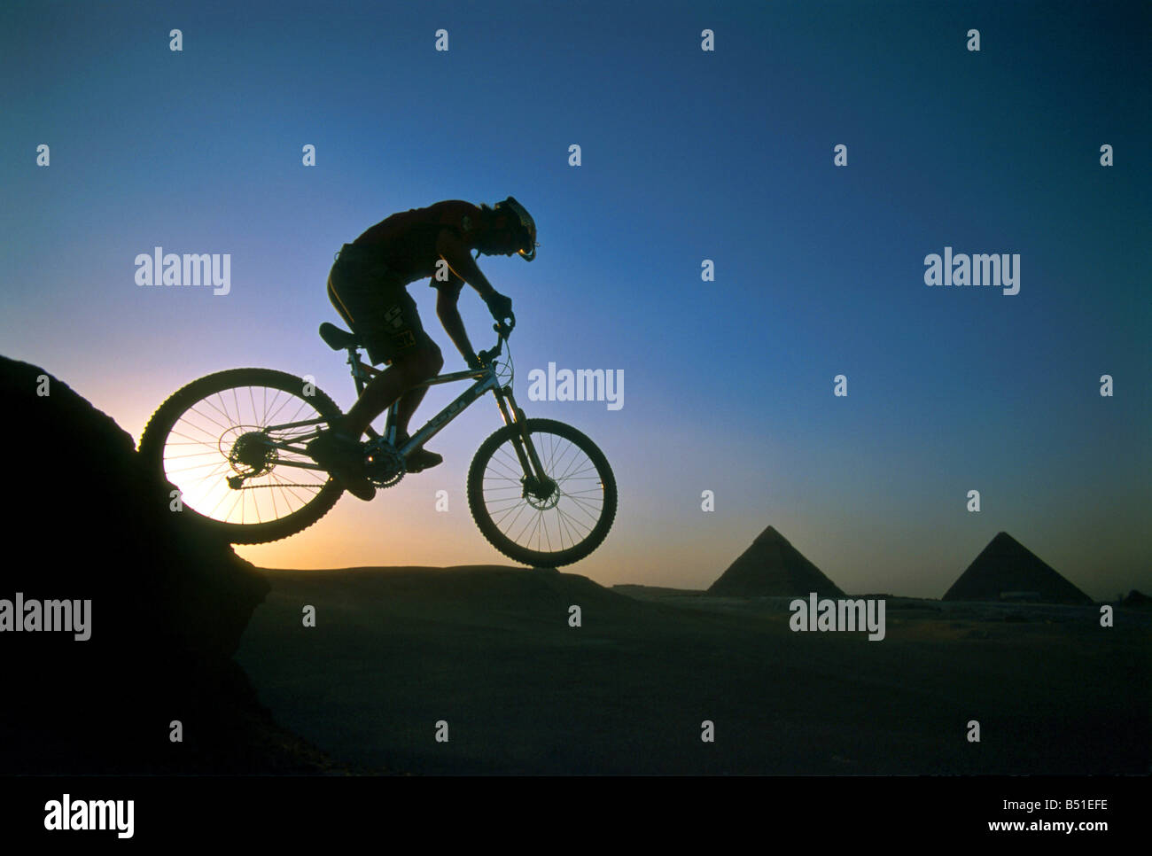 World Champion mountain biker, Hans Rey, riding near the Pyramids, Giza ...