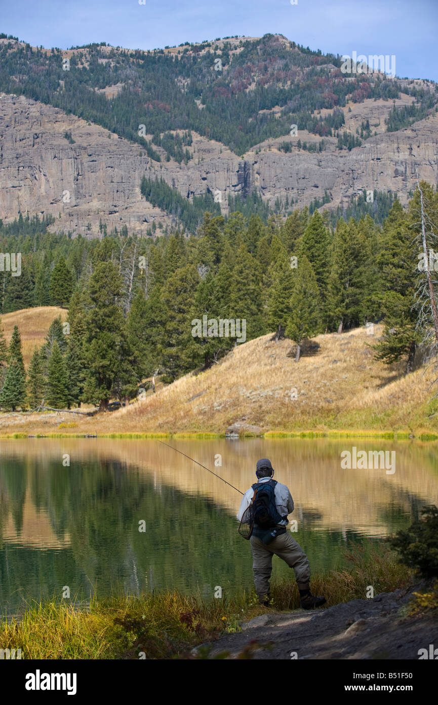 Montana, Yellowstone National Park. A man hikes on a beautiful fall day ...