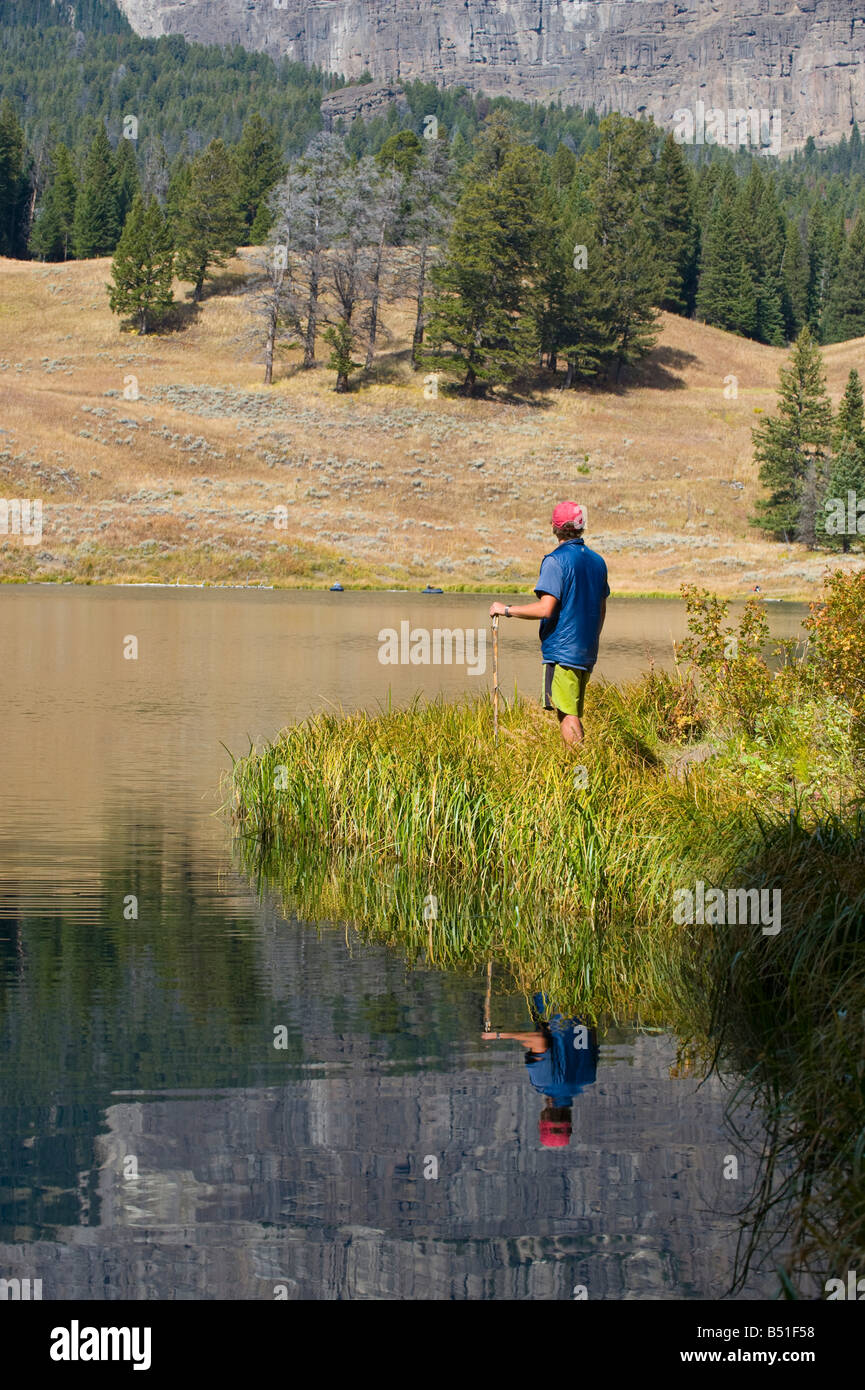Montana, Yellowstone National Park. A man hikes on a beautiful fall day ...