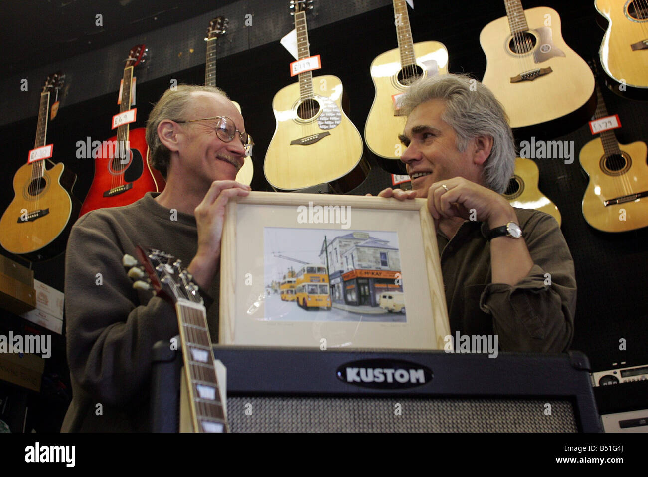 Lindisfarne band member Ray Jackson right presents a painting called ...