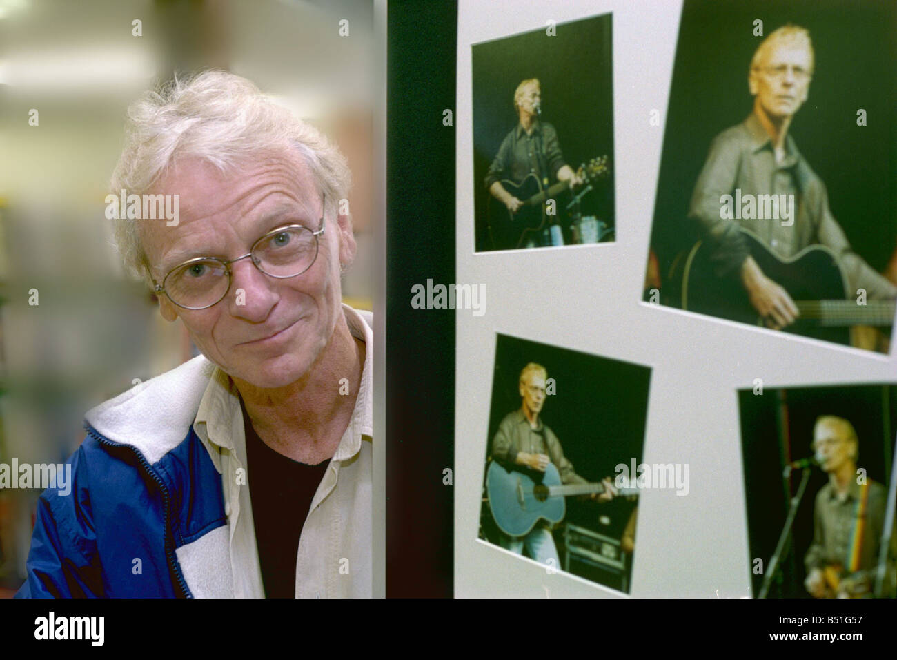 Billy Mitchell of the pop group Lindisfarne with pictures of members of ...