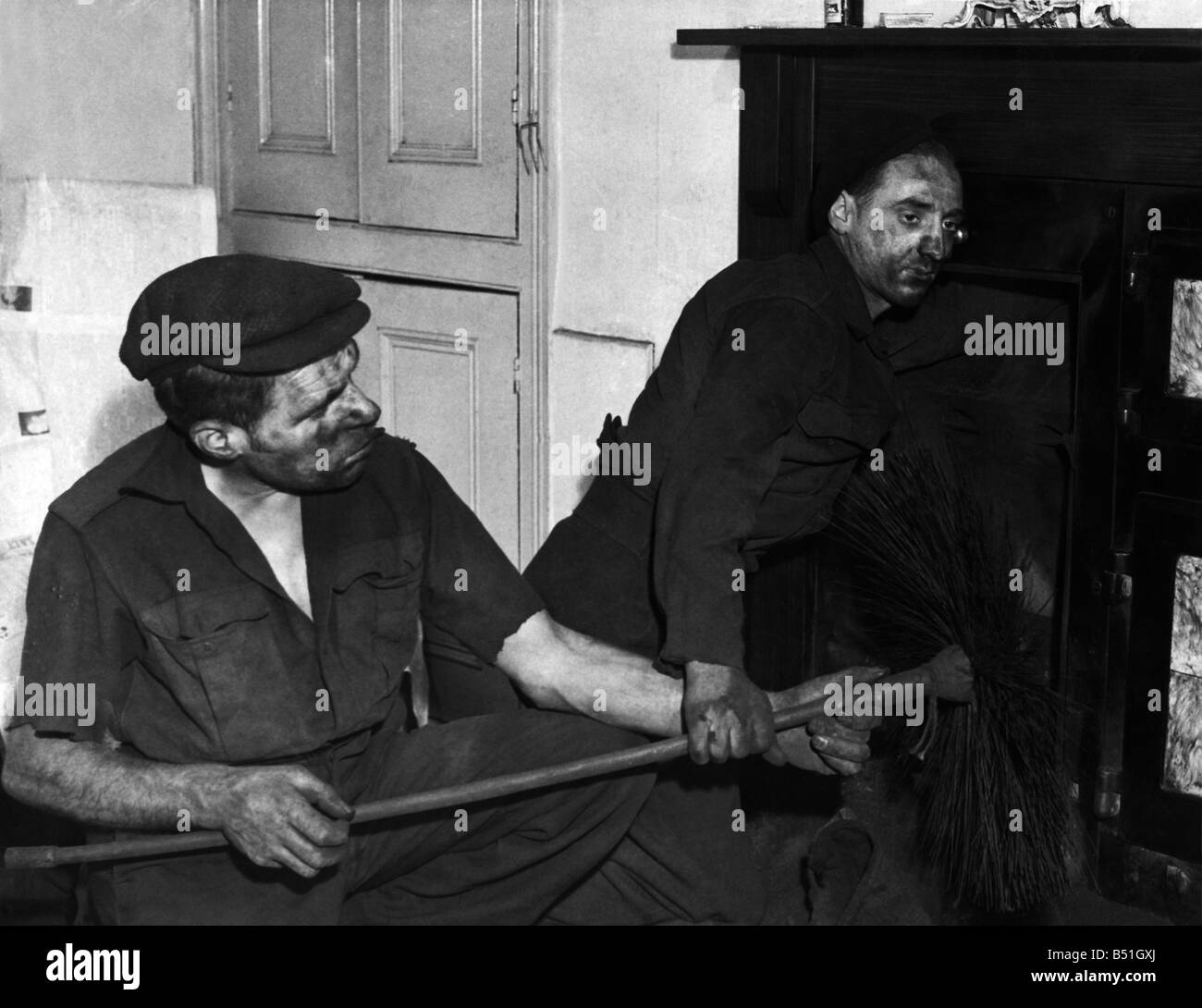 Chimney Sweeps Mr. Cuttriss (left) and Lionel who are working on a ...