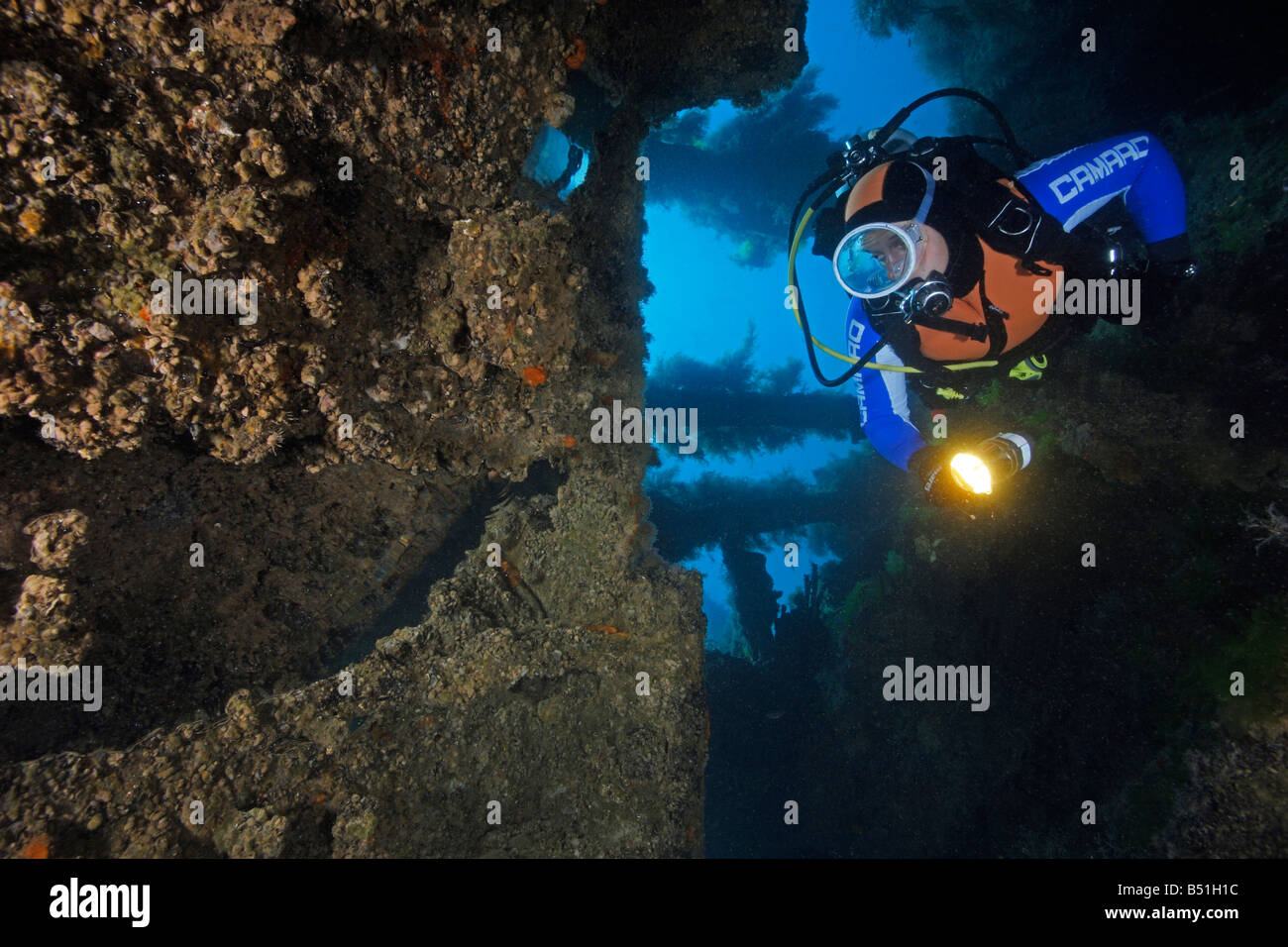 scuba diver inside a sunken ship, greek cargo ship Peninsula Crimea ...