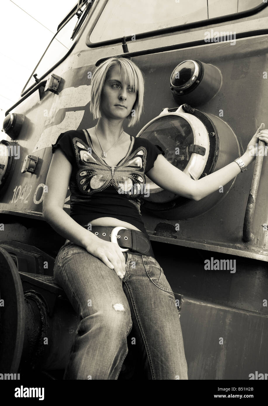 young woman posing on locomotive Stock Photo - Alamy