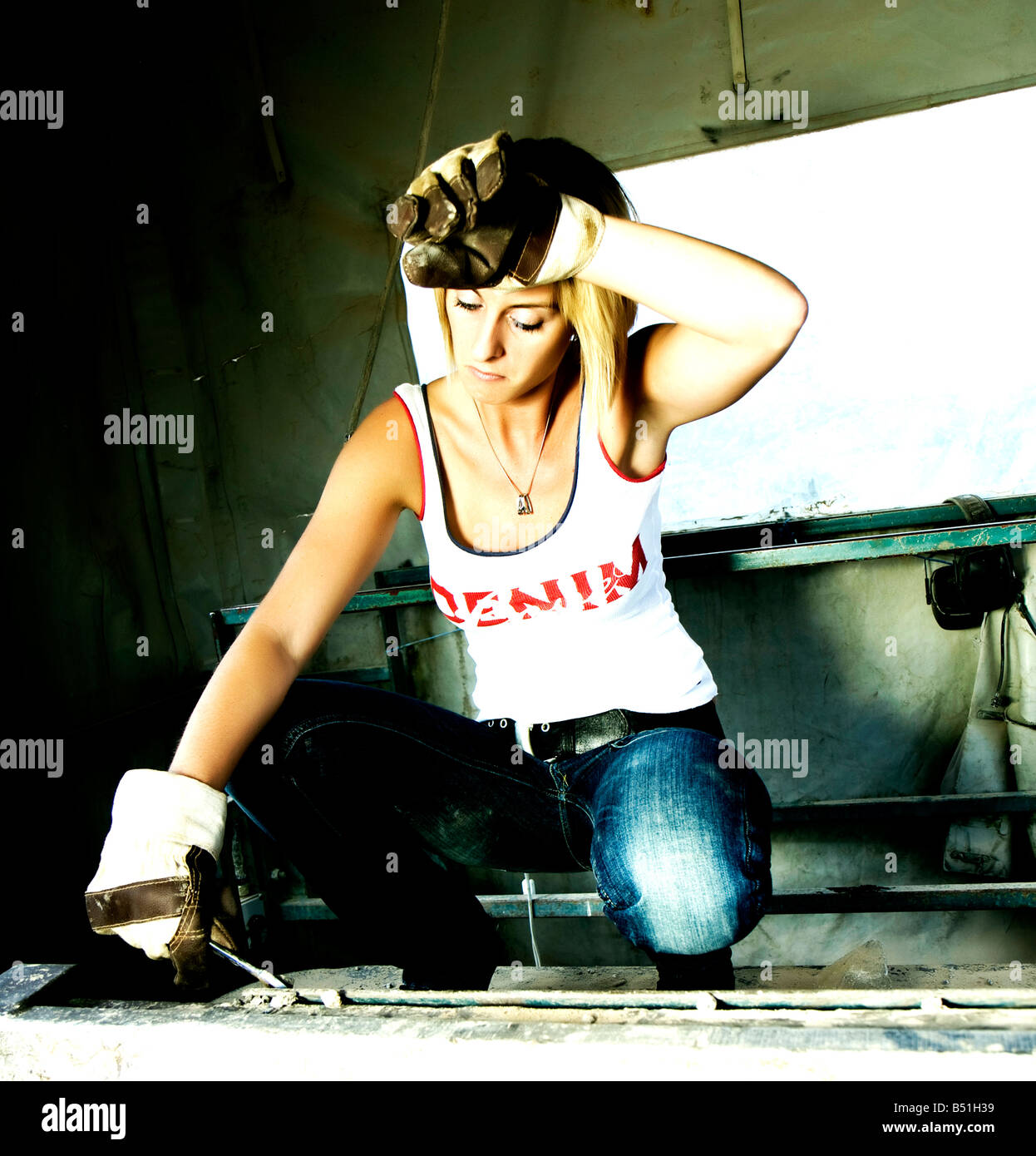 young woman doing hard work on construction site Stock Photo - Alamy