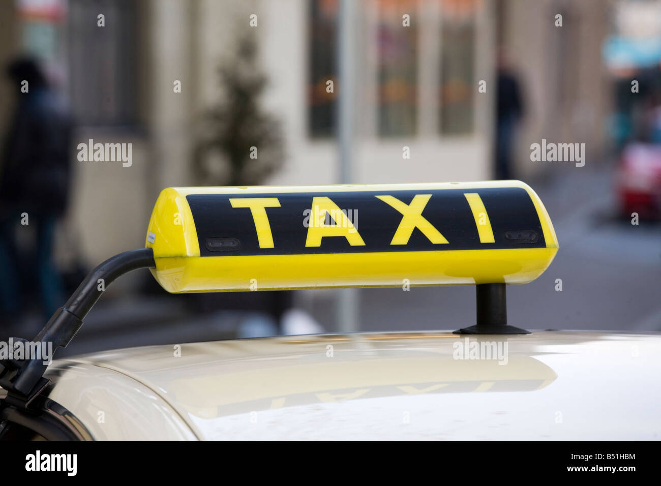Taxi sign on car roof Stock Photo - Alamy