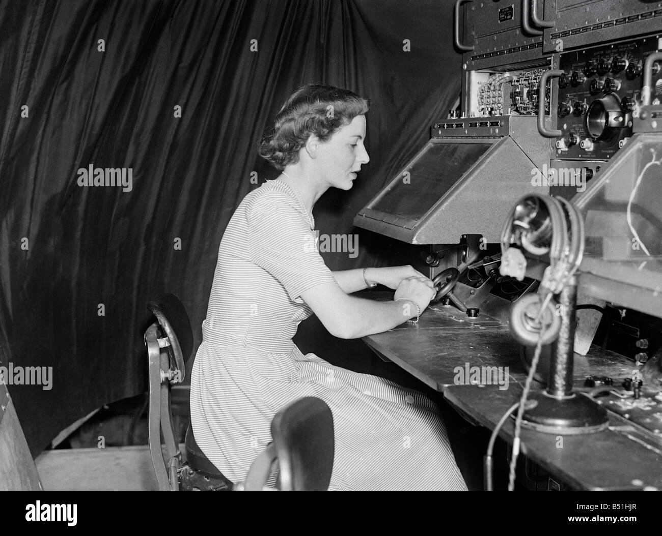Terry Watts Radar tracker at London Airport Sits before apparatus. She ...