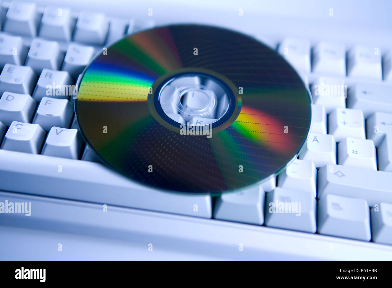 DVD on computer keyboard Stock Photo - Alamy