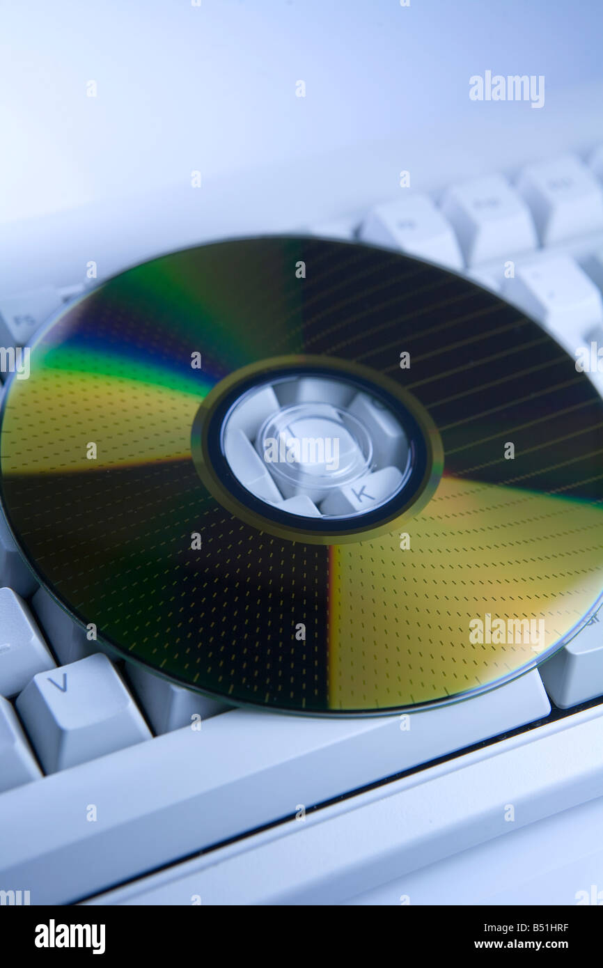 DVD on computer keyboard Stock Photo - Alamy