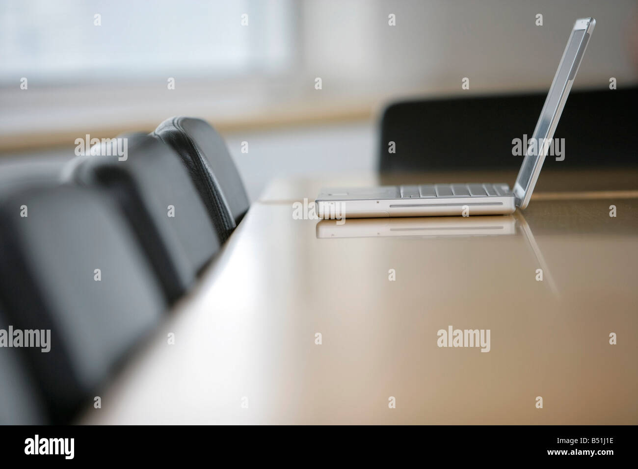 Laptop Computer on Boardroom Table Stock Photo - Alamy