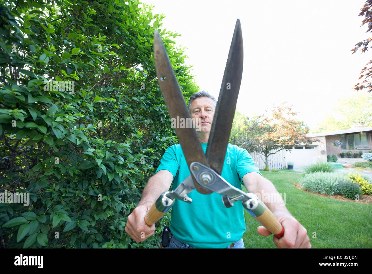 Man doing yard work hi-res stock photography and images - Alamy
