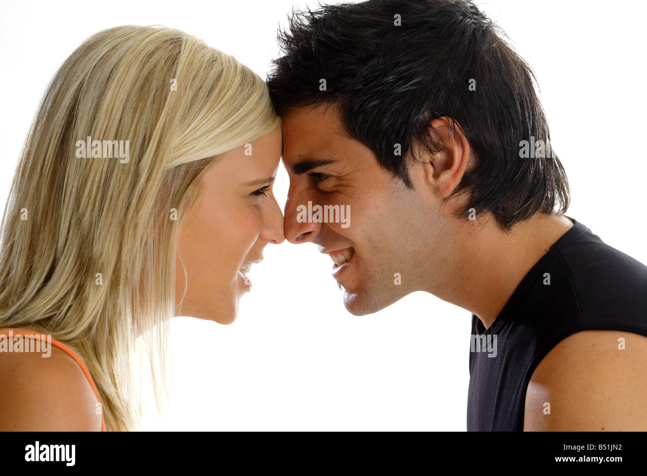 Young couple puts their heads together Stock Photo - Alamy