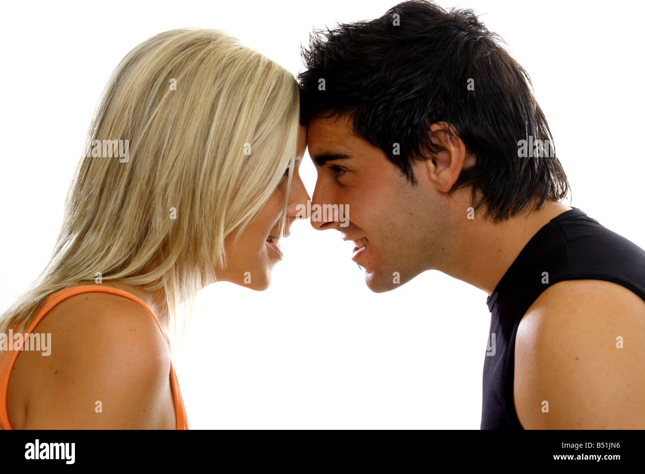 Young couple puts their heads together Stock Photo - Alamy