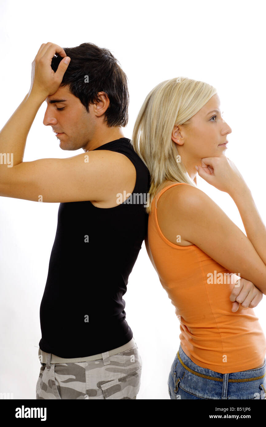 young couple back to back Stock Photo - Alamy