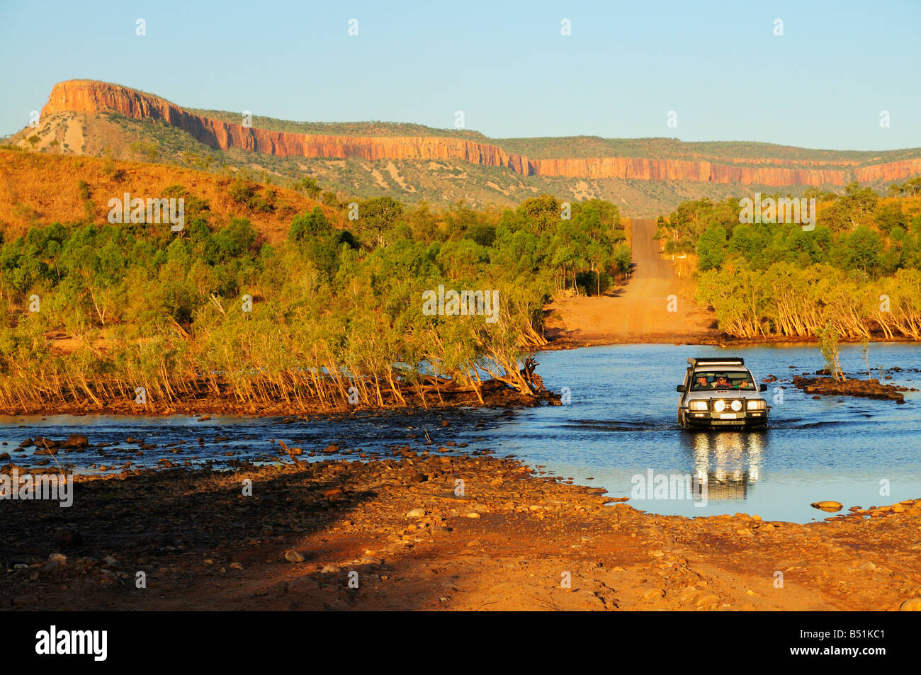 SUV Crossing Pentecost River with Cockburn Ranges in Background, Gibb ...
