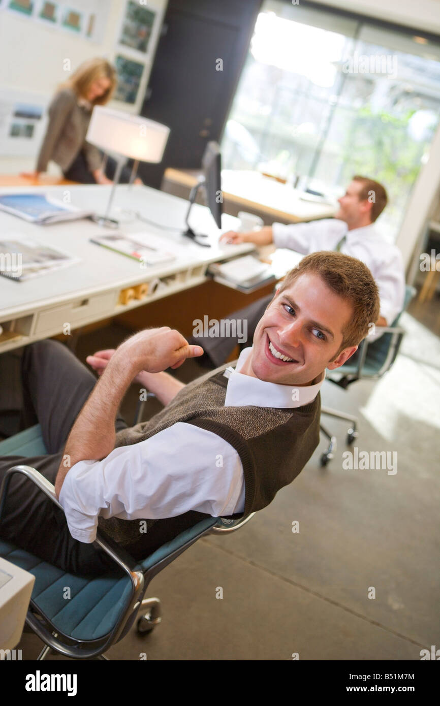Young Man Looking Over Shoulder Stock Photo - Alamy