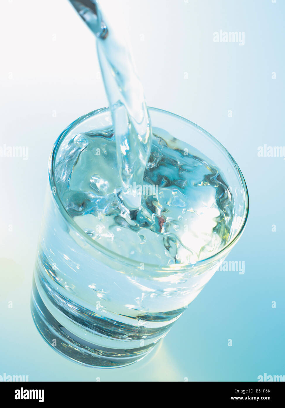 Water Pouring into Glass Stock Photo - Alamy