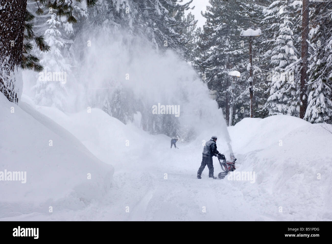 People Clearing Snow After Storm Stock Photo - Alamy