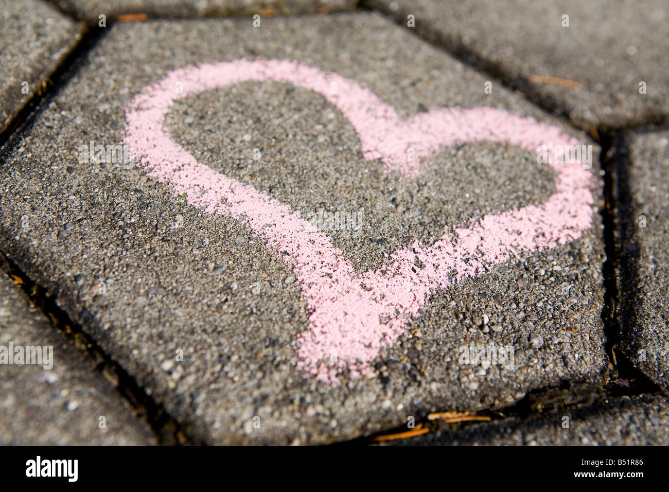 pink heart painted on stone Stock Photo - Alamy