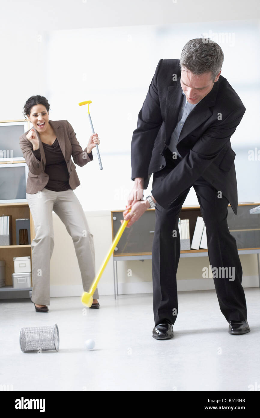 Business executive playing golf hi-res stock photography and images - Alamy