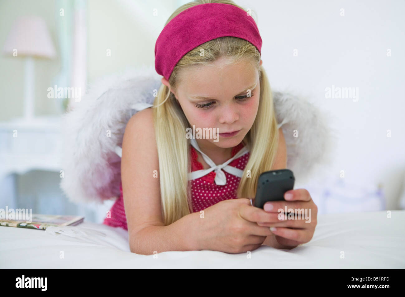 Young Girl Using Cell Phone Stock Photo - Alamy