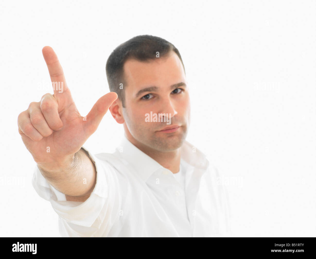 Portrait of Man Holding up Two Fingers Stock Photo - Alamy